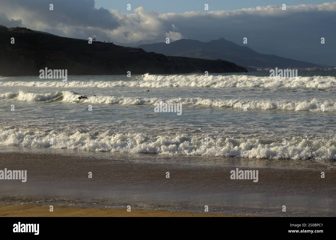 Basque Country, dark sand beach Playa de La Arena Biscayan between ...