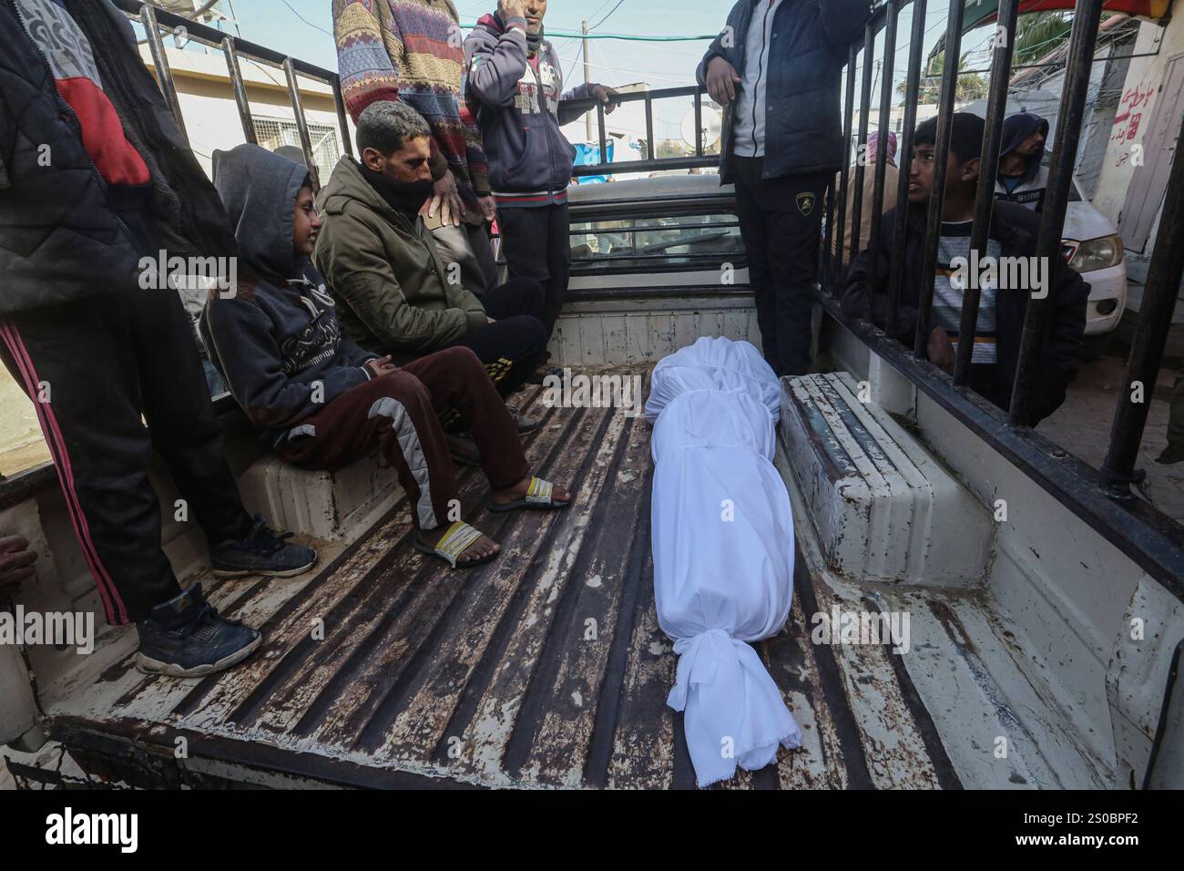 Relatives of the Palestinians died in Israeli attacks, mourn as they ...