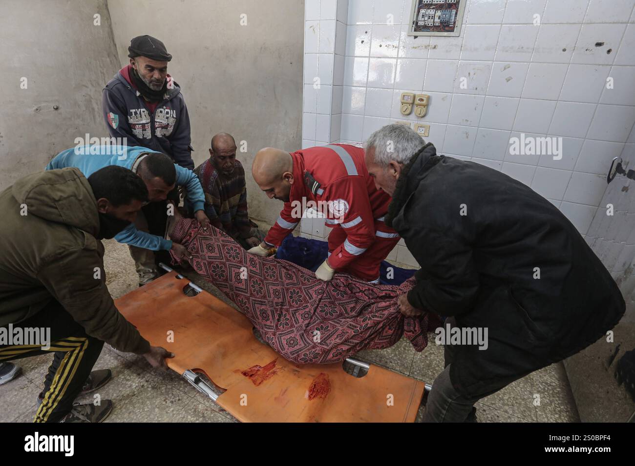 Relatives of the Palestinians died in Israeli attacks, mourn as they ...