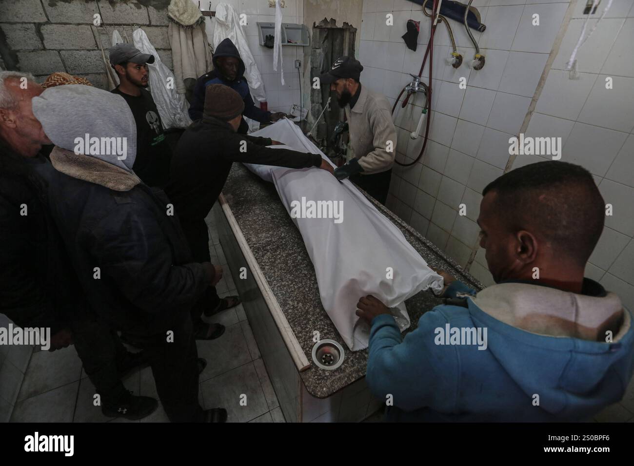 Relatives of the Palestinians died in Israeli attacks, mourn as they ...