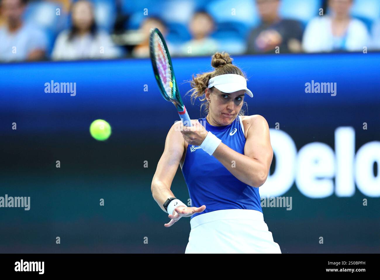 Beatriz Haddad Maia of Brazil plays a forehand shot to opponent Xinyu ...