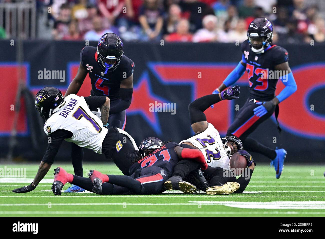 Houston Texans safety Calen Bullock (21) tackles Baltimore Ravens ...