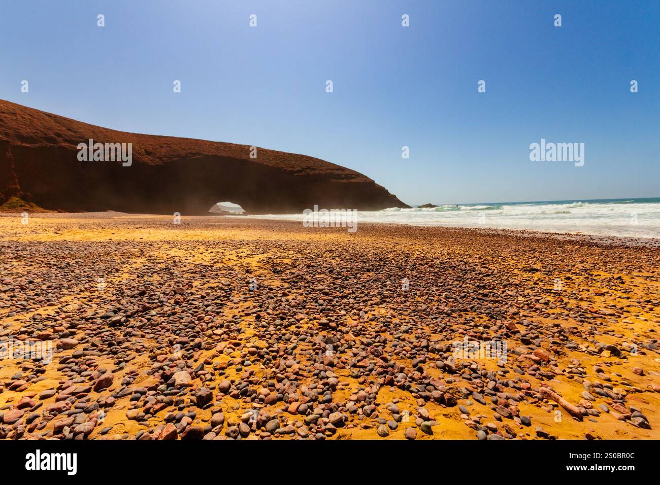 Picturesque coastal red rocks on the Atlantic Ocean coast. Legzira ...