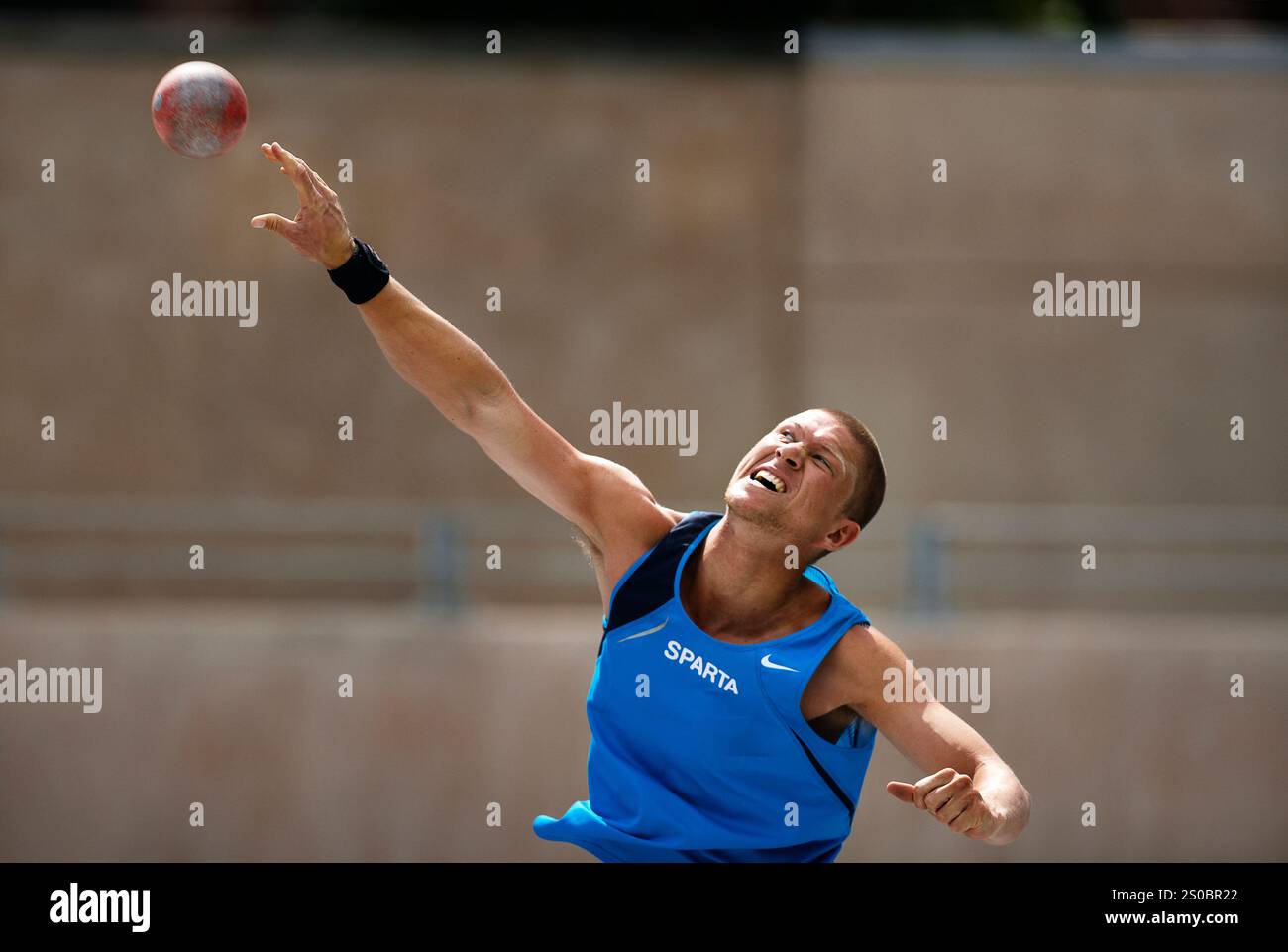 Athlete doing a shot put at Osterbro Stadium in Copenhagen Stock Photo ...