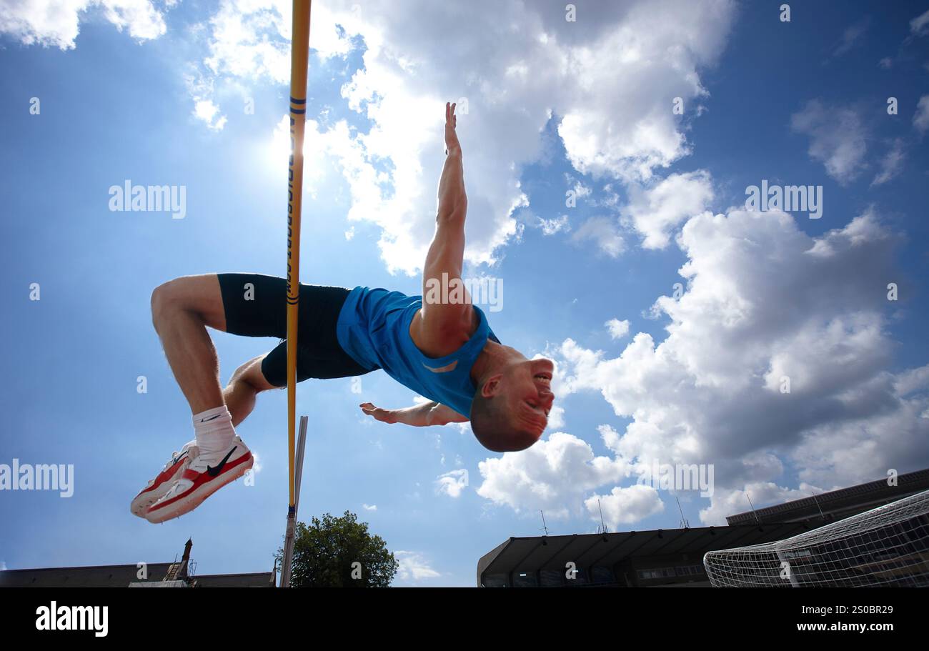 Athlete doing a high jump at Osterbro Stadium in Copenhagen Stock Photo ...