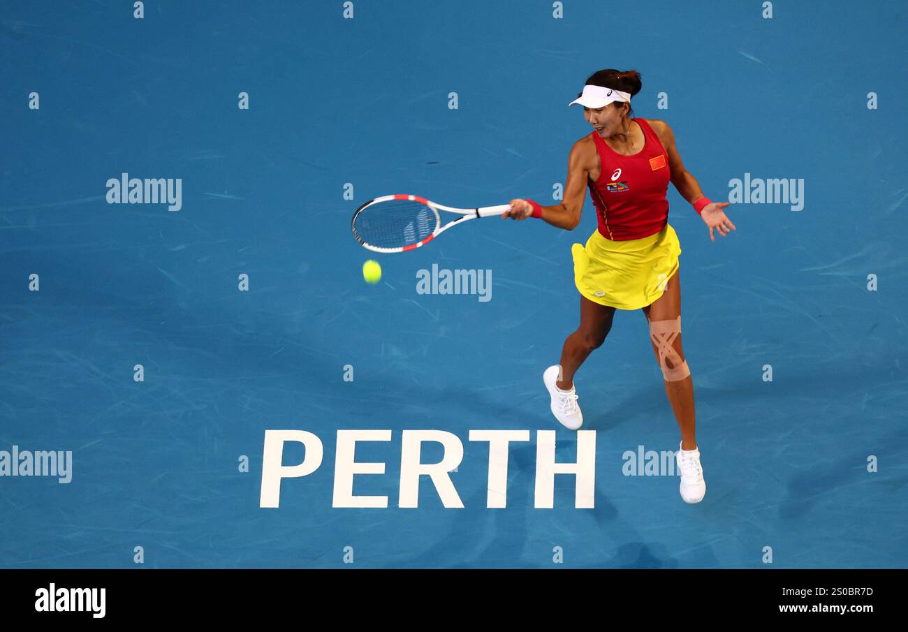 Xinyu Gao of China plays a forehand shot to opponent Beatriz Haddad ...