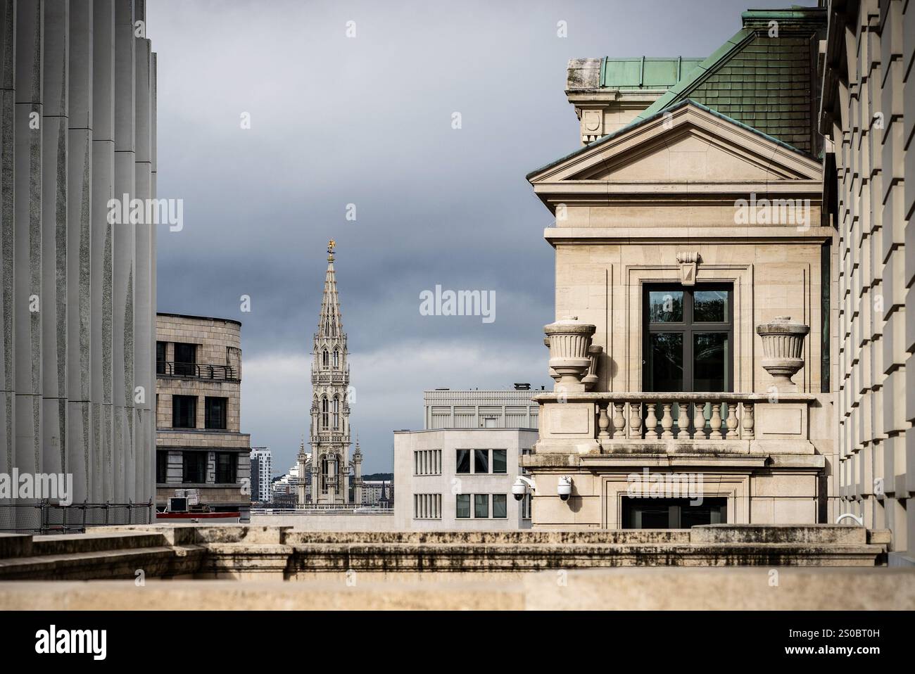 A view of architectural buildings with a prominent spire in the ...
