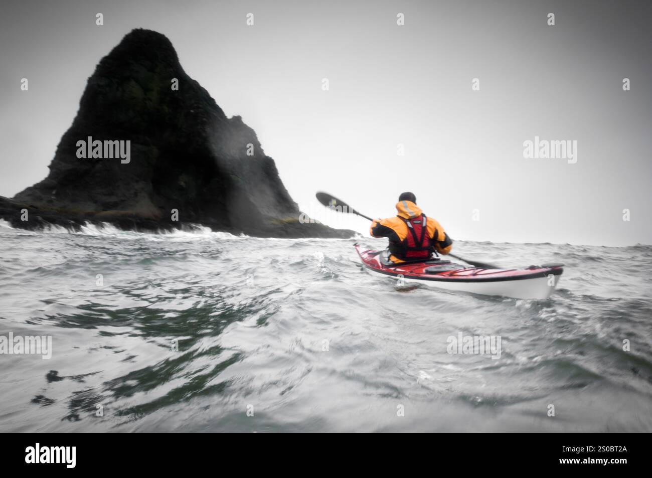 Todd Van Raden braves a 10 foot swell as he sea kayaks around the sea ...