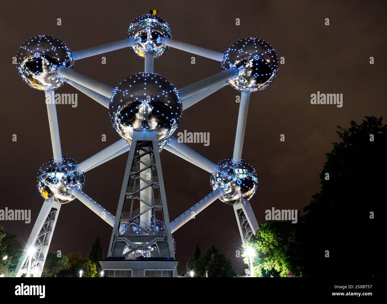 The Atomium in Brussels, Belgium, illuminated at night, showcasing its ...