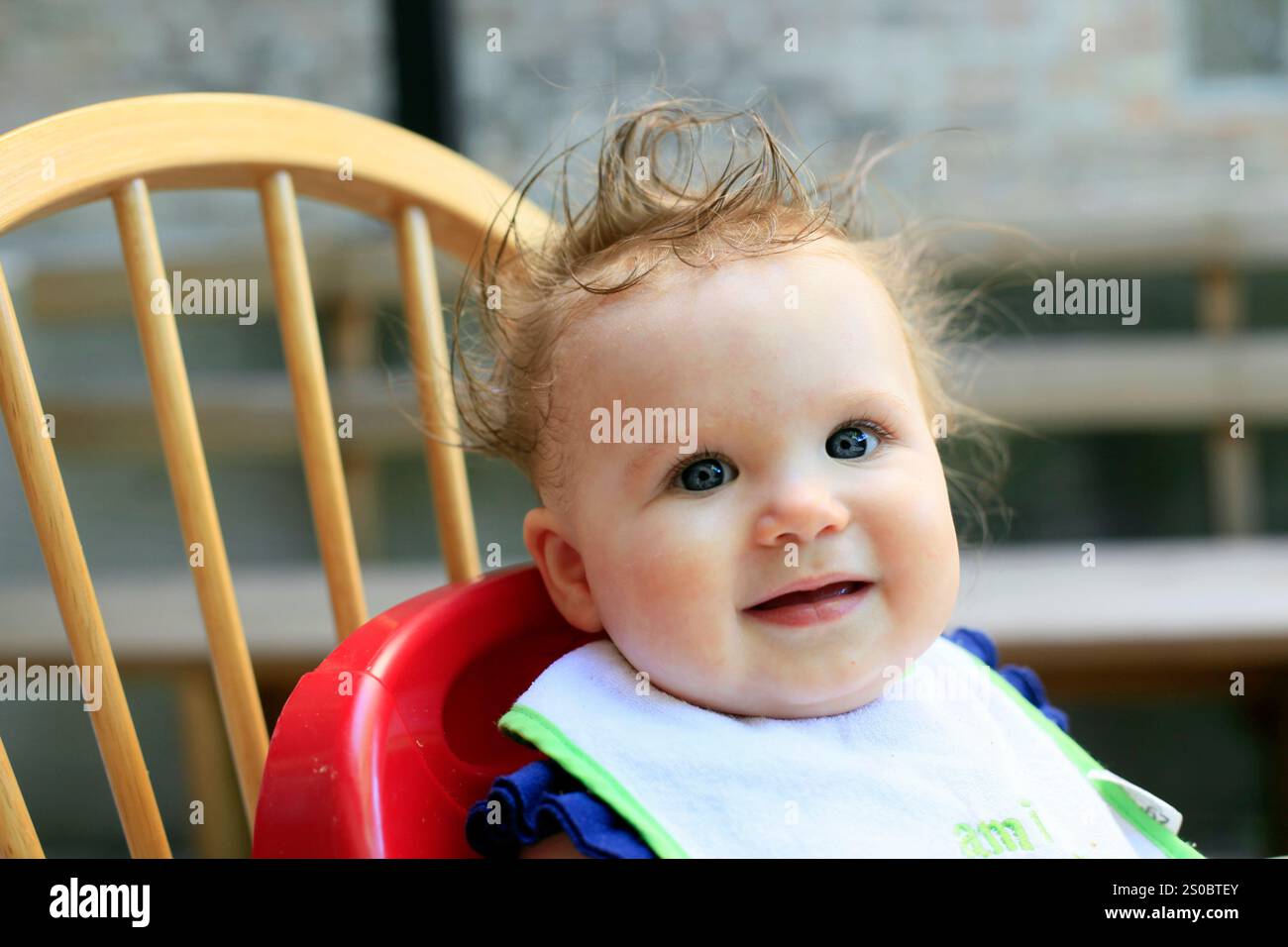 Baby eating outside Stock Photo - Alamy