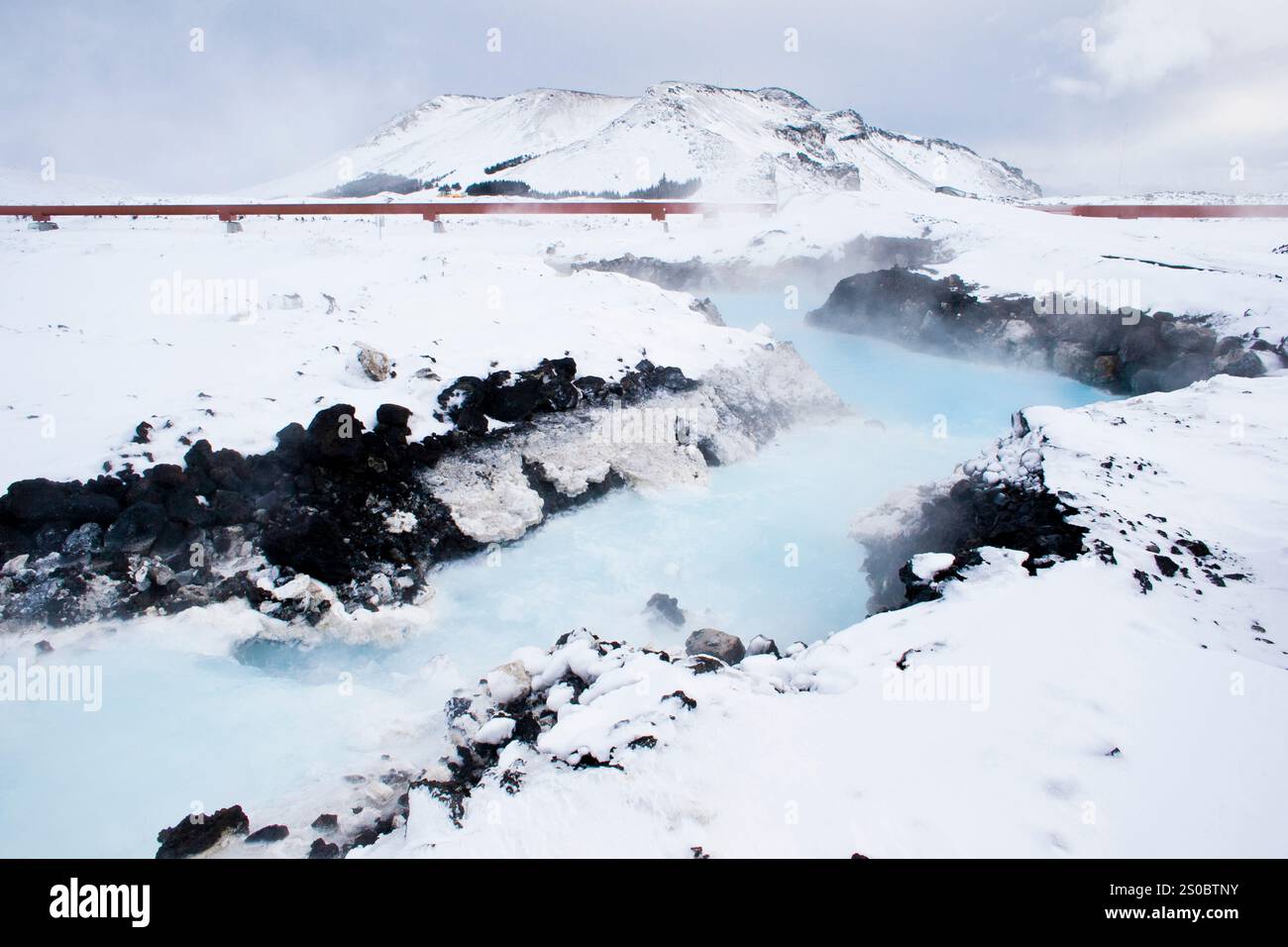 Blue water and red pipes at geothermal plant Stock Photo - Alamy