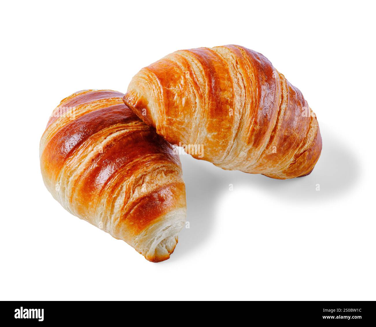 freshly baked in oven two croissants isolated in a white background ...