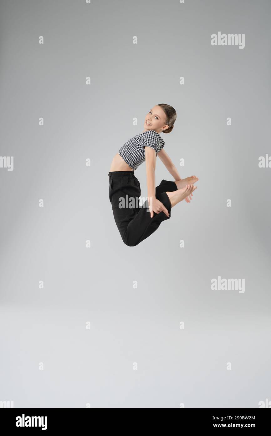 Girl showcases expressive dance moves in a dynamic studio setting Stock ...