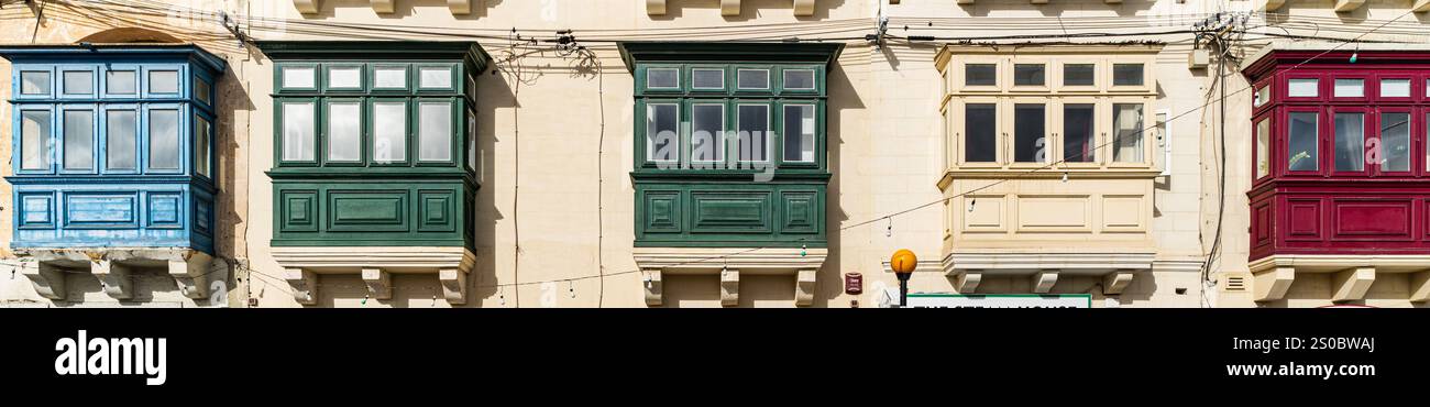 Traditional house detail in Malta. Limestone yellow bricks and colorful ...