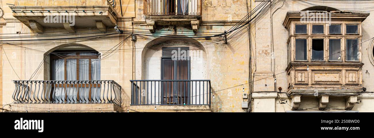 Traditional house detail in Malta. Limestone yellow bricks and colorful ...