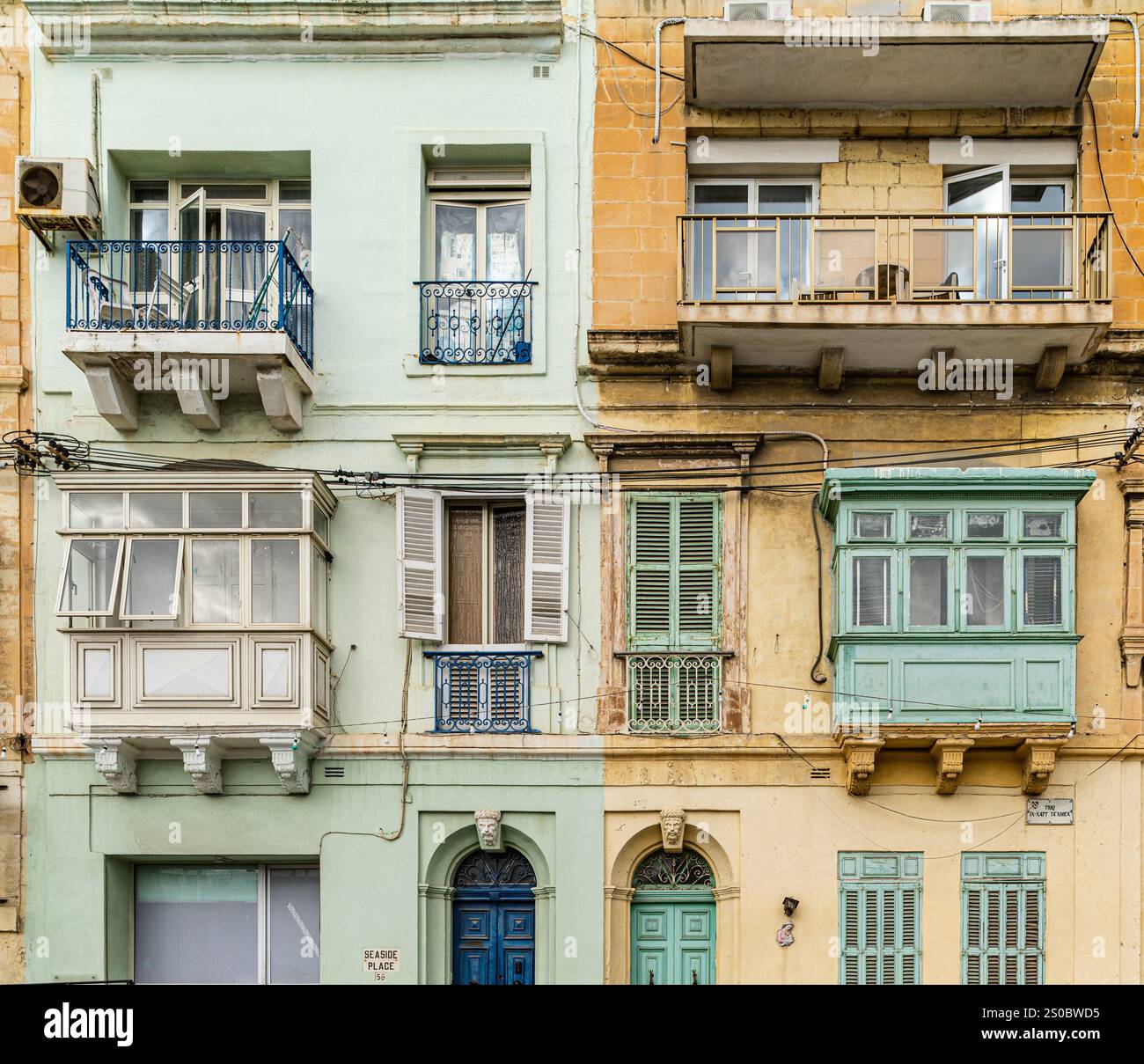 Traditional house detail in Malta. Limestone yellow bricks and colorful ...