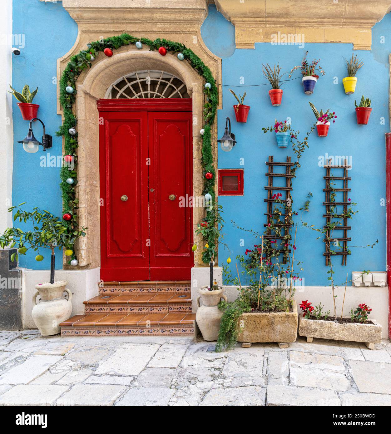 Traditional house detail in Malta. Limestone yellow bricks and colorful ...
