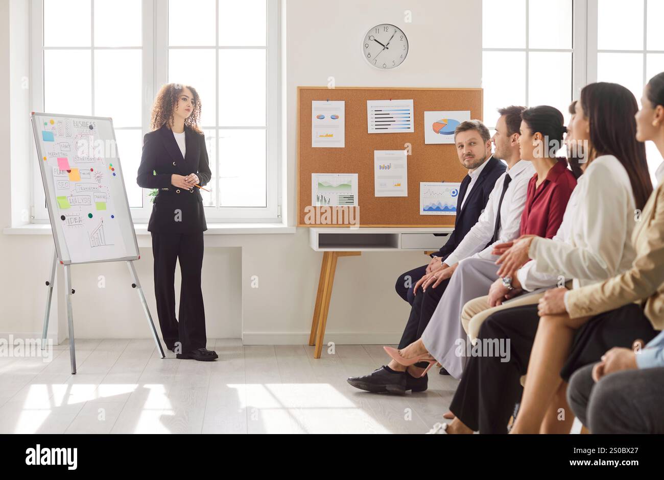 Young businesswoman giving presentation, boss manager, female coach ...