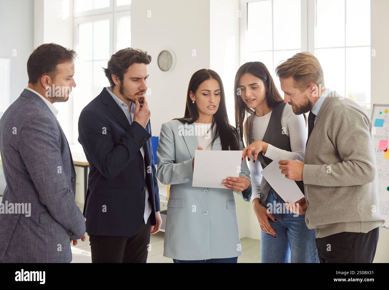 Group of Colleagues Discussing Ideas During a Meeting in a Modern ...