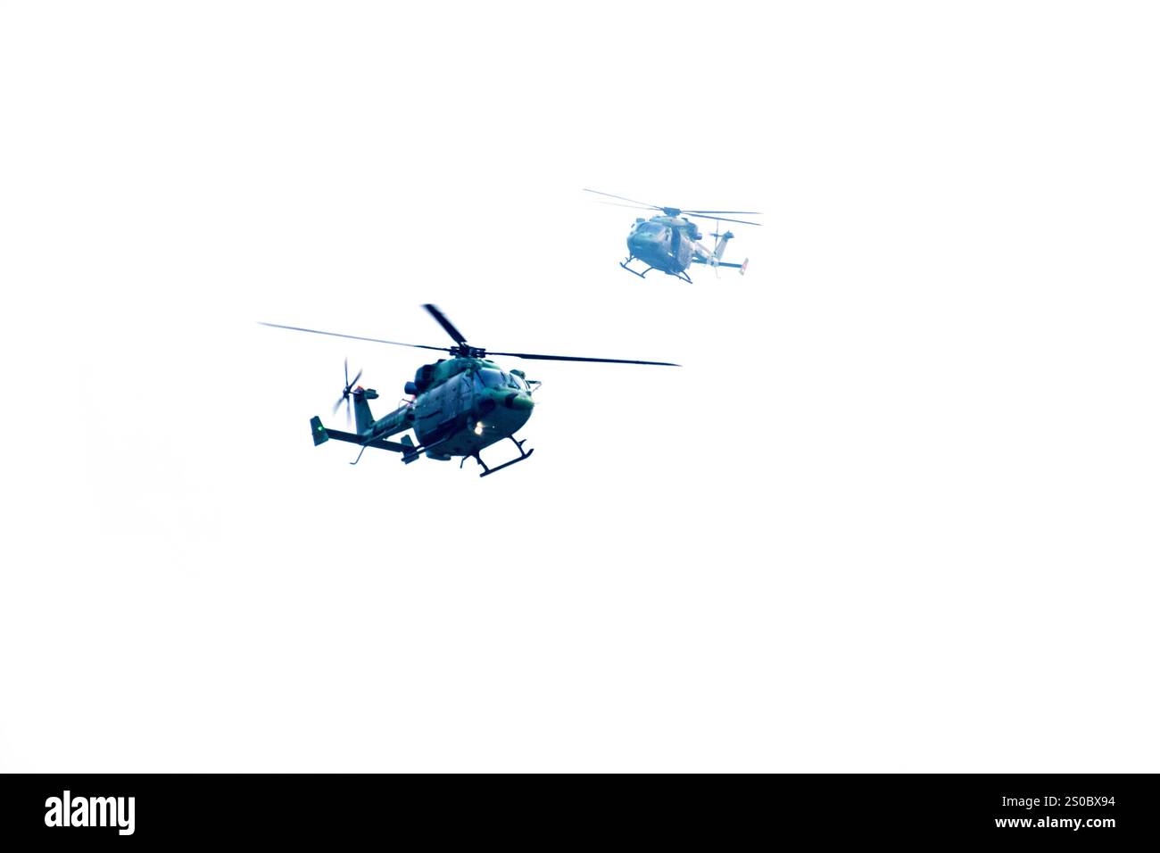 Military helicopter air attack by a squadron on isolated white ...