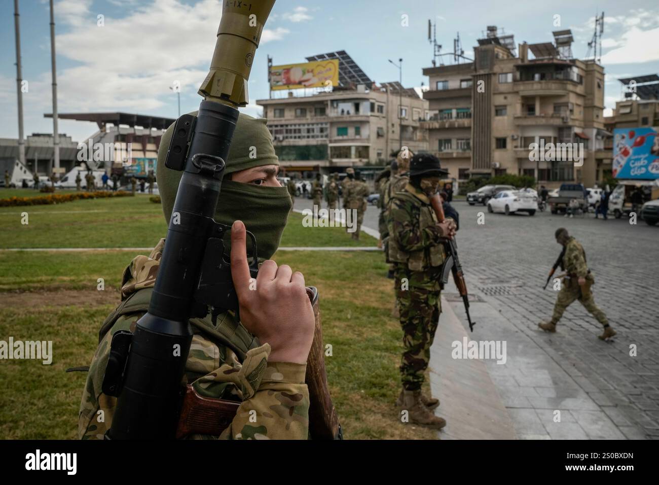 Members of the armed forces and former rebels, who overthrew Bashar ...
