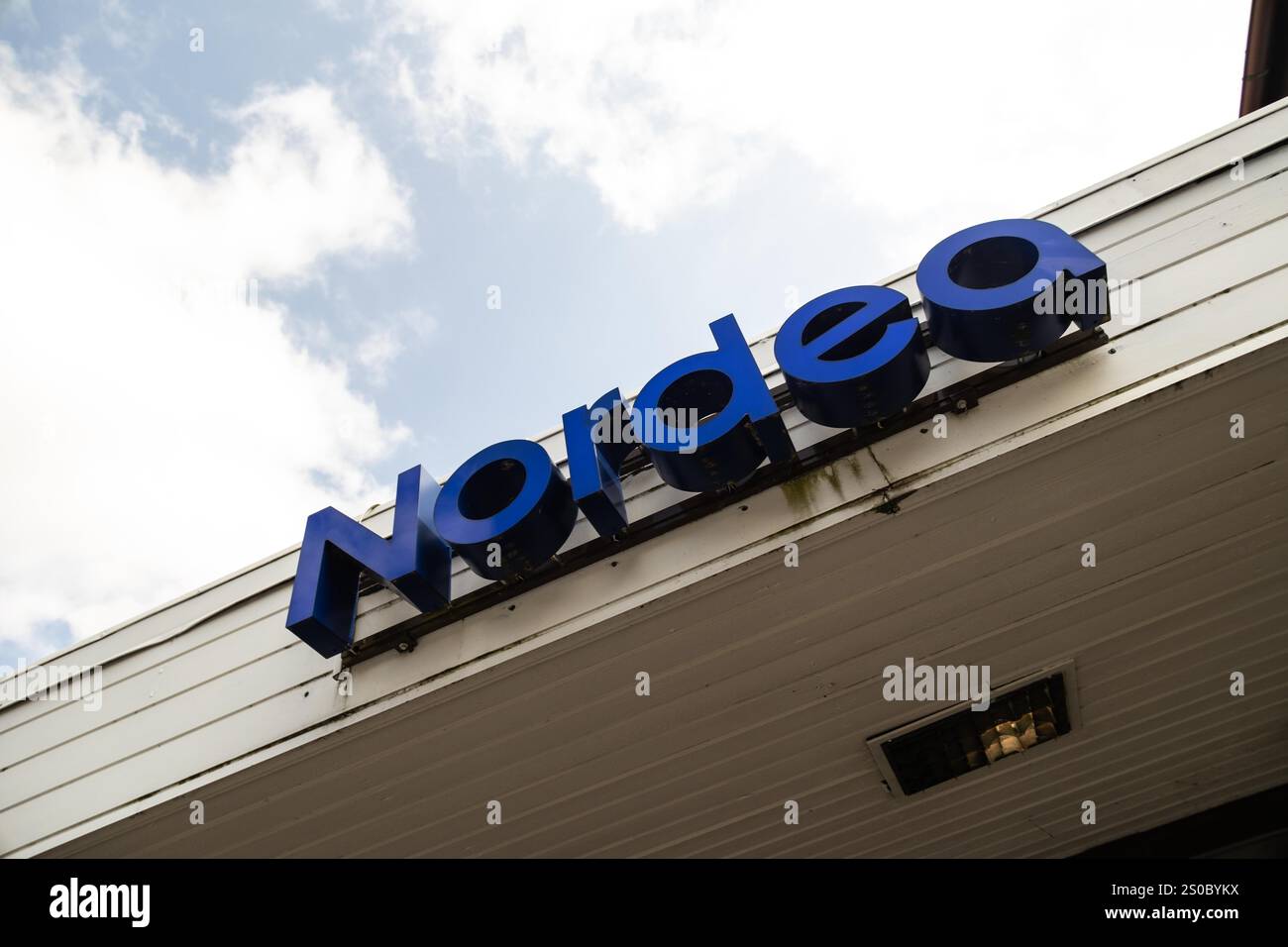 A view of a Nordea logo above one of its branches in Kinna Stock Photo ...