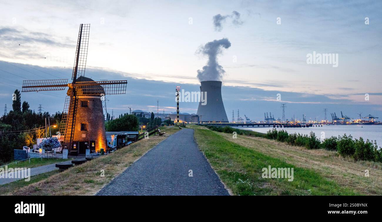 A scenic view featuring a traditional windmill on the left and a modern ...