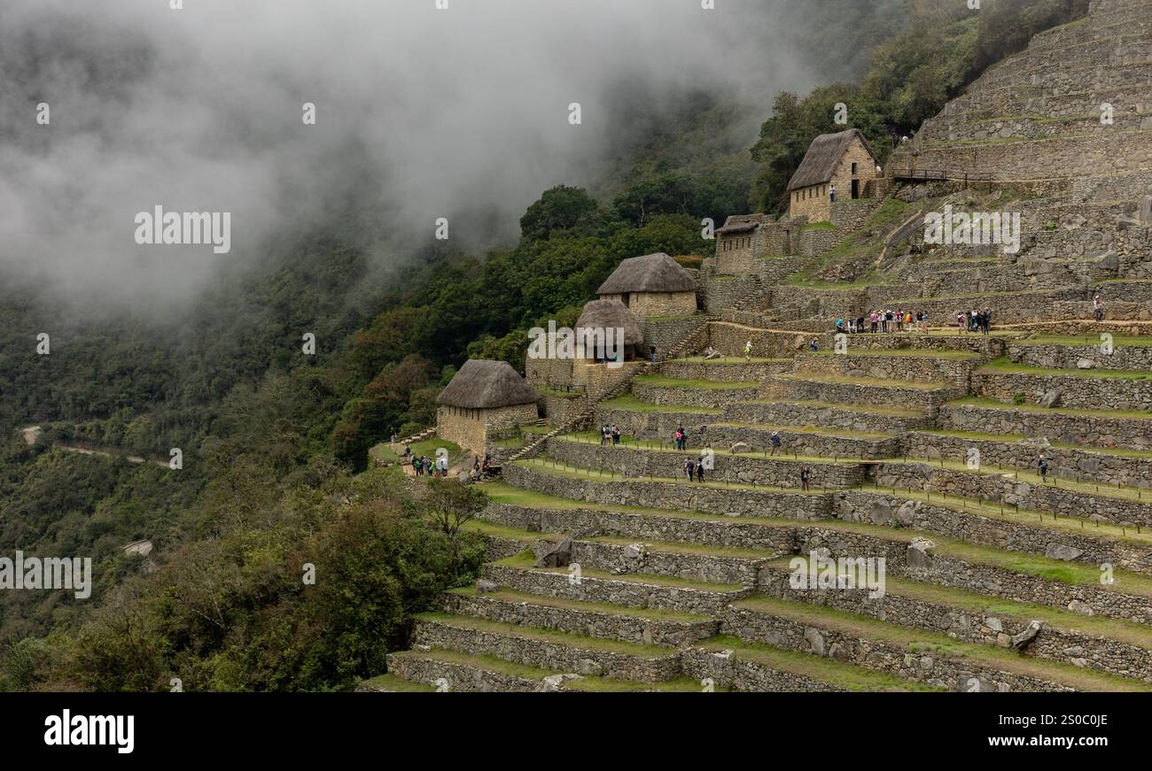 Machu Picchu ruins in Peru during a misty morning Stock Photo - Alamy