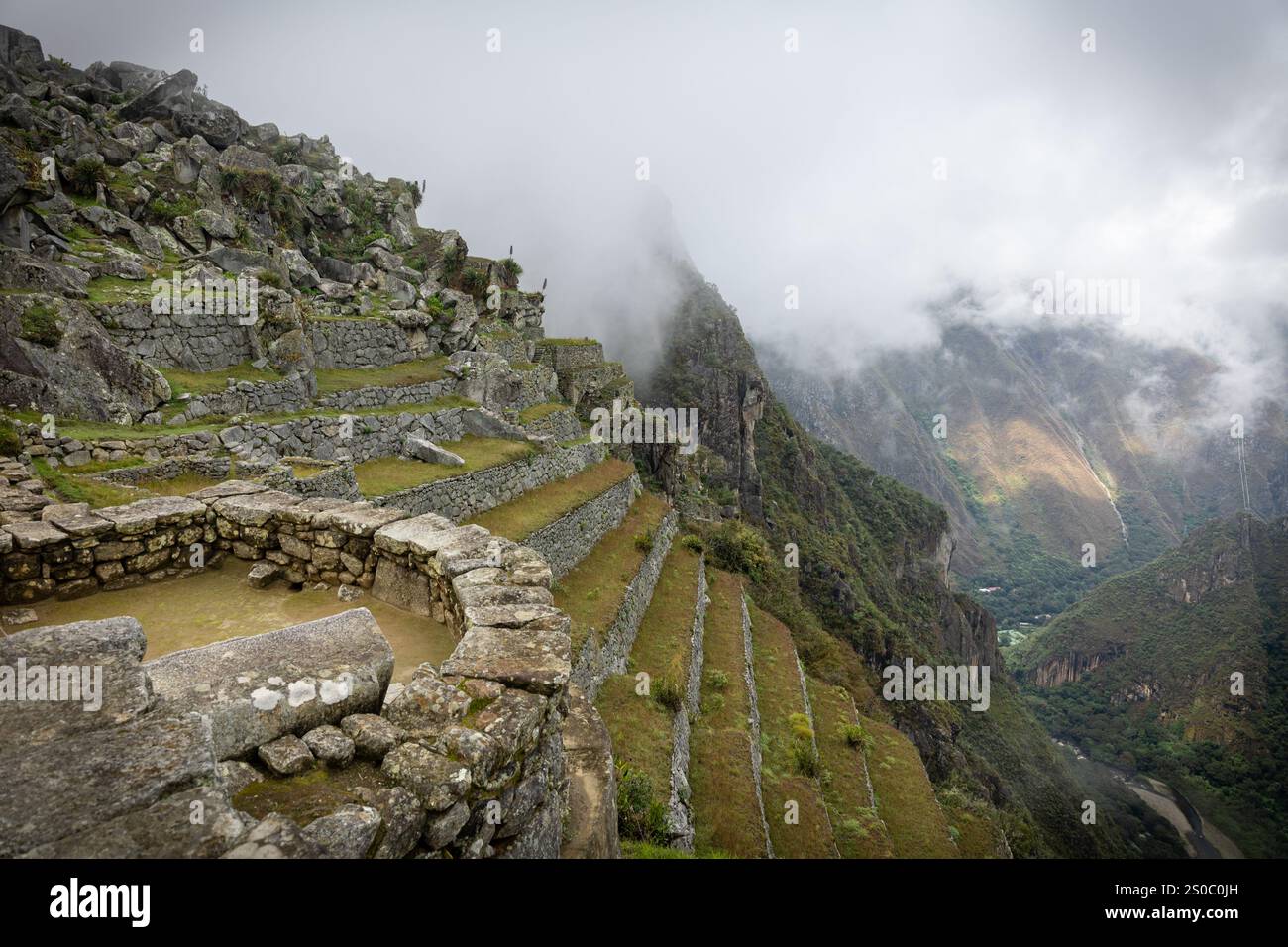 Machu Picchu ruins in Peru during a misty morning Stock Photo - Alamy