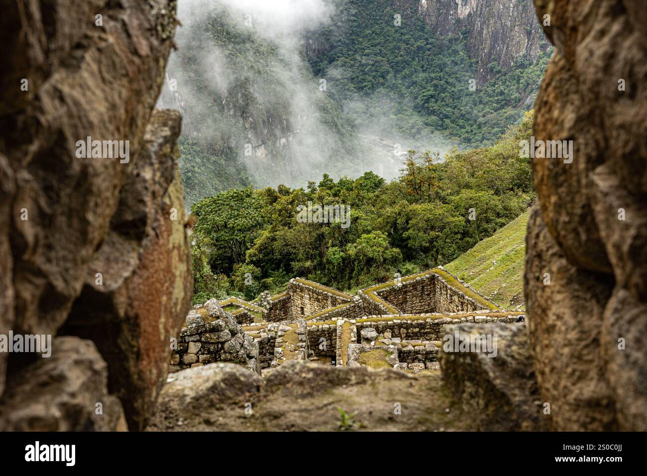 Machu Picchu ruins in Peru during a misty morning Stock Photo - Alamy