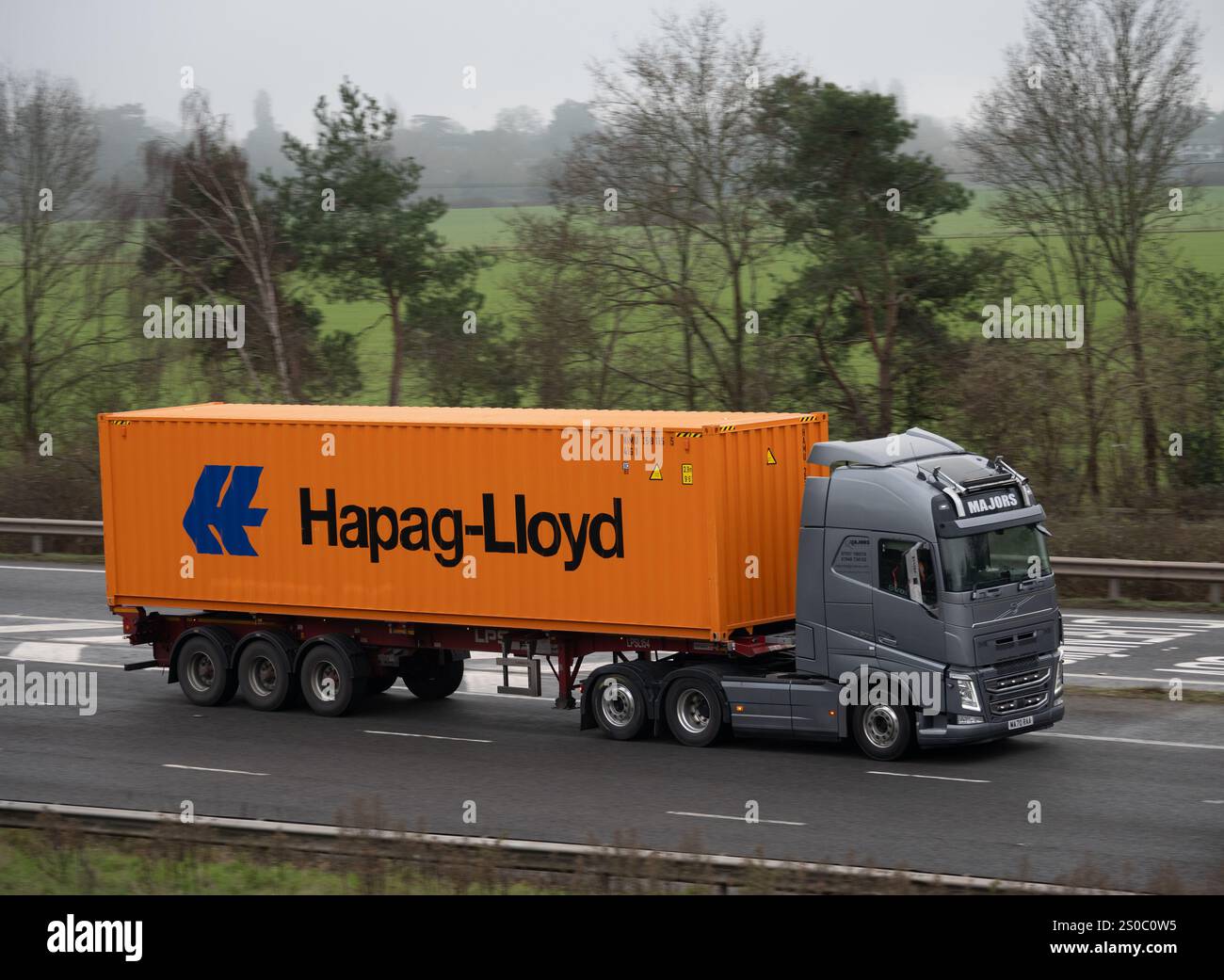Majors lorry carrying a Hapag-Lloyd container on the M40 motorway ...