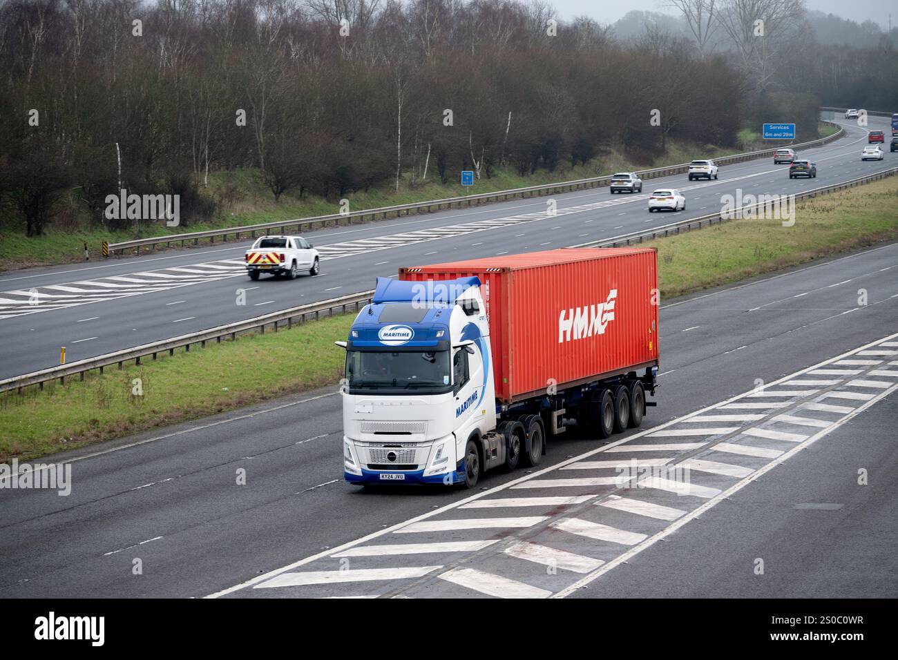 Maritime lorry carrying a HMM container on the M40 motorway ...