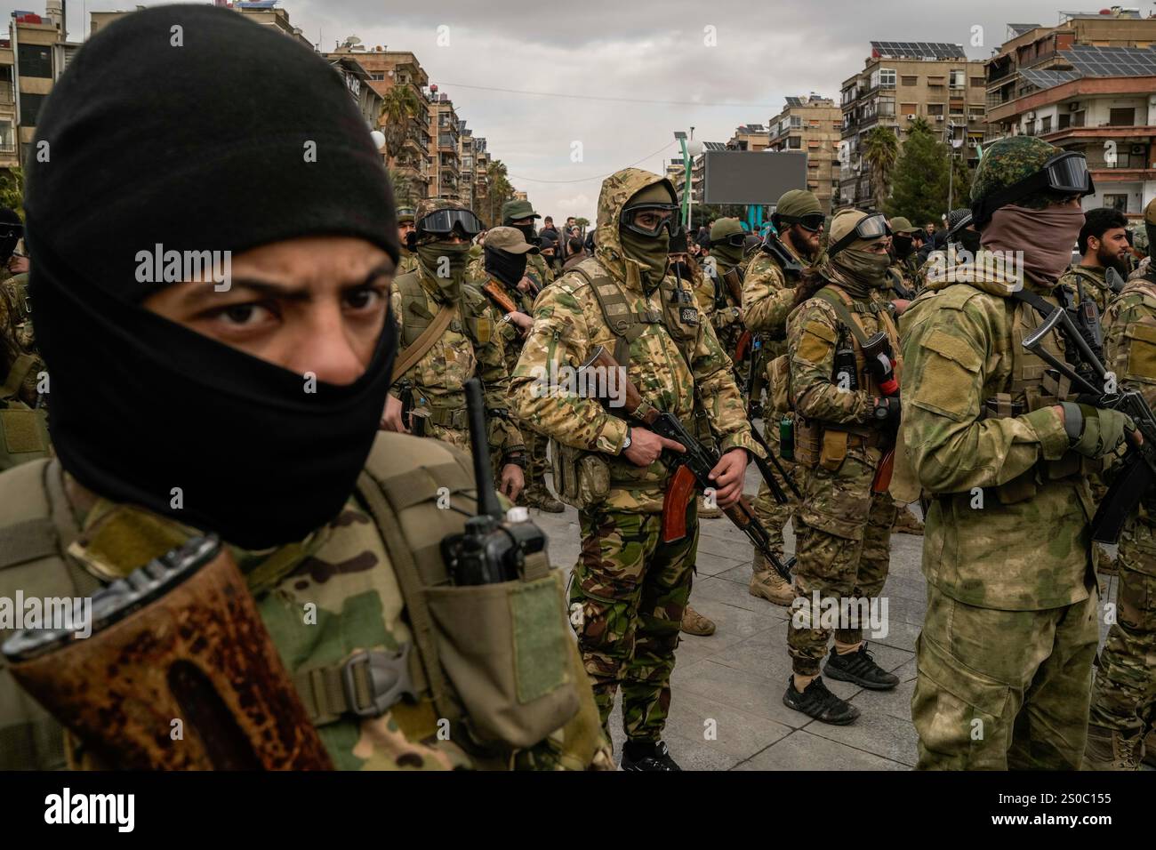 Members of the new armed forces, former rebels who overthrew Bashar ...