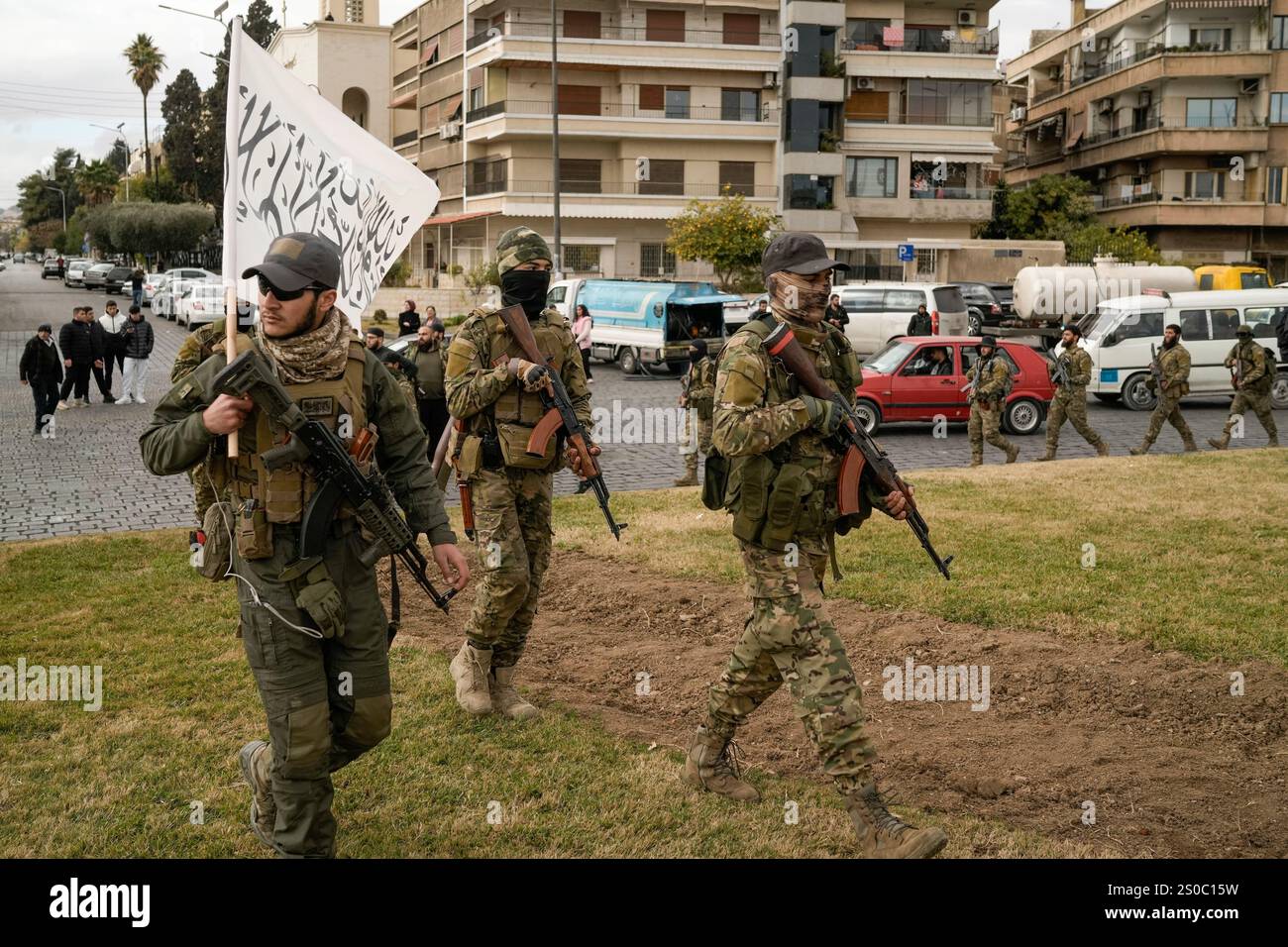 Members of the new armed forces, former rebels who overthrew Bashar ...