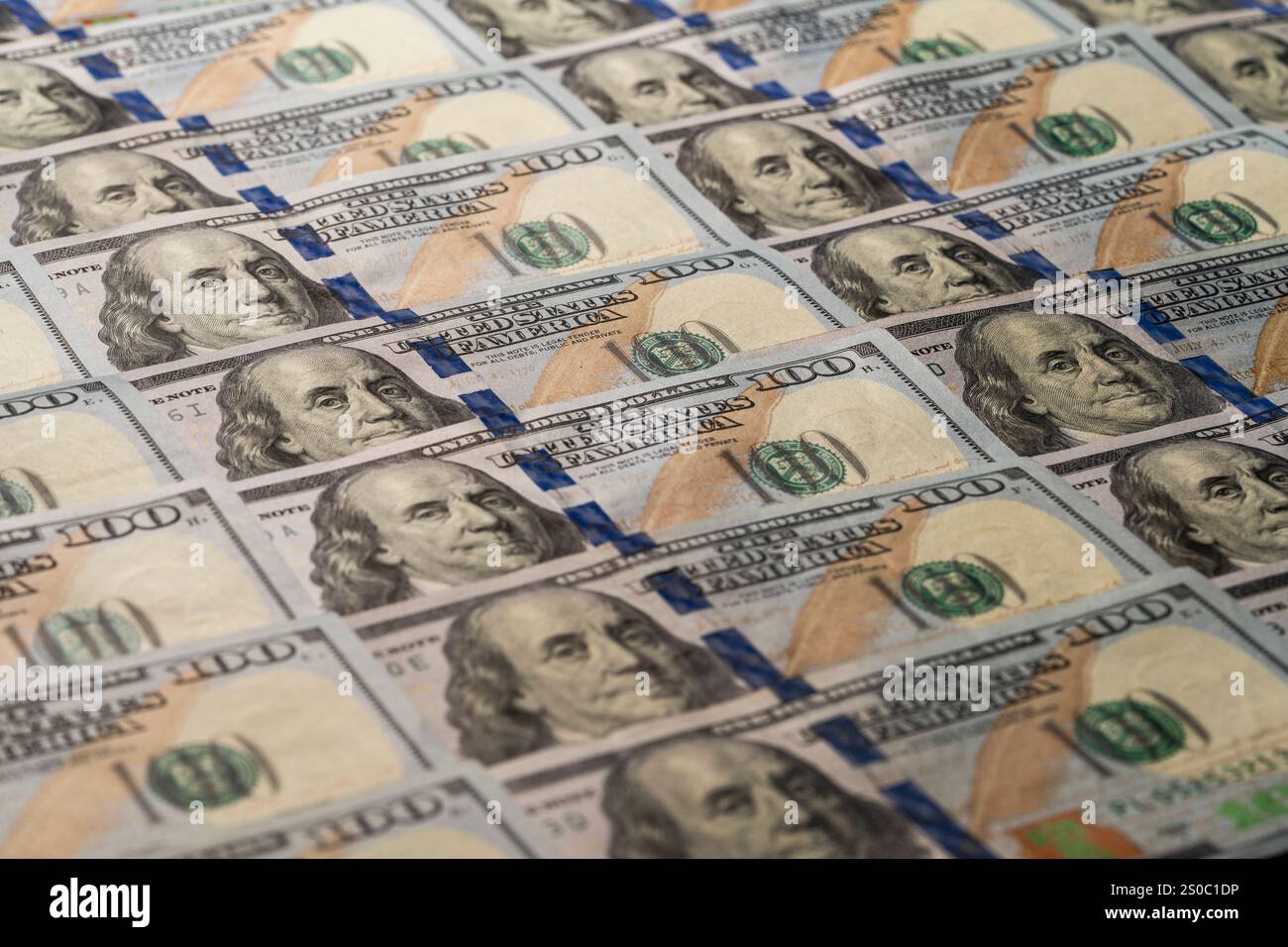 Background of many american one hundred dollar banknotes. A pile of new ...