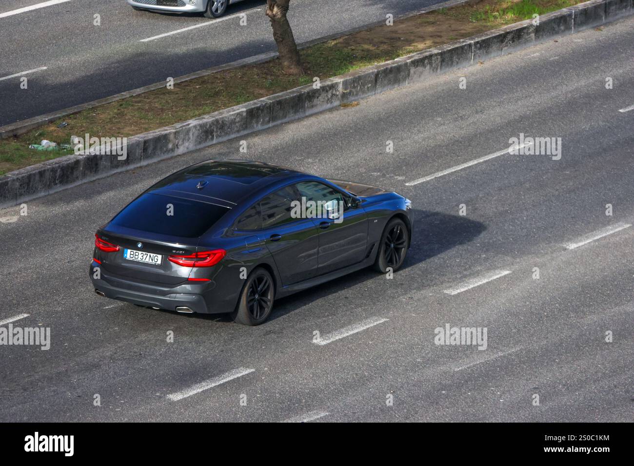 Dark gray bmw 6 series gran turismo driving on a multi lane road Stock ...