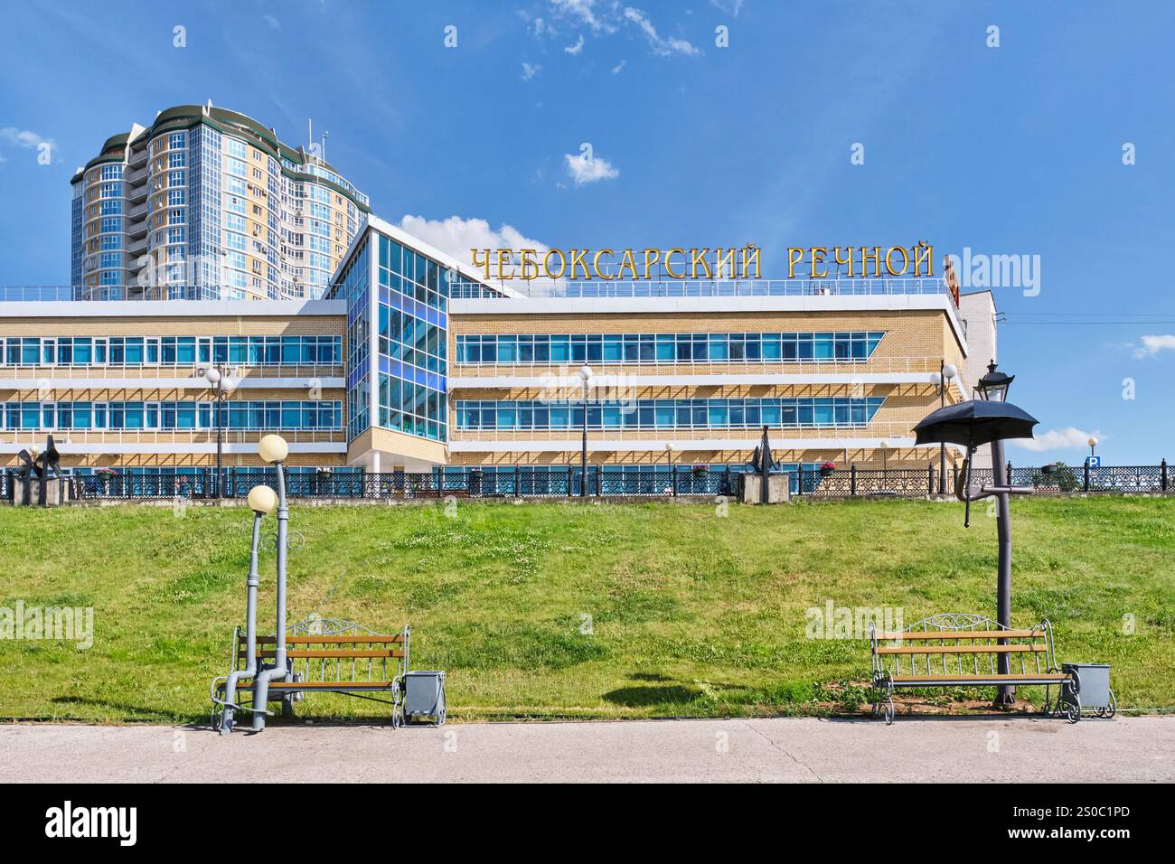 Creative street benches with lamp posts. Modern river port office ...