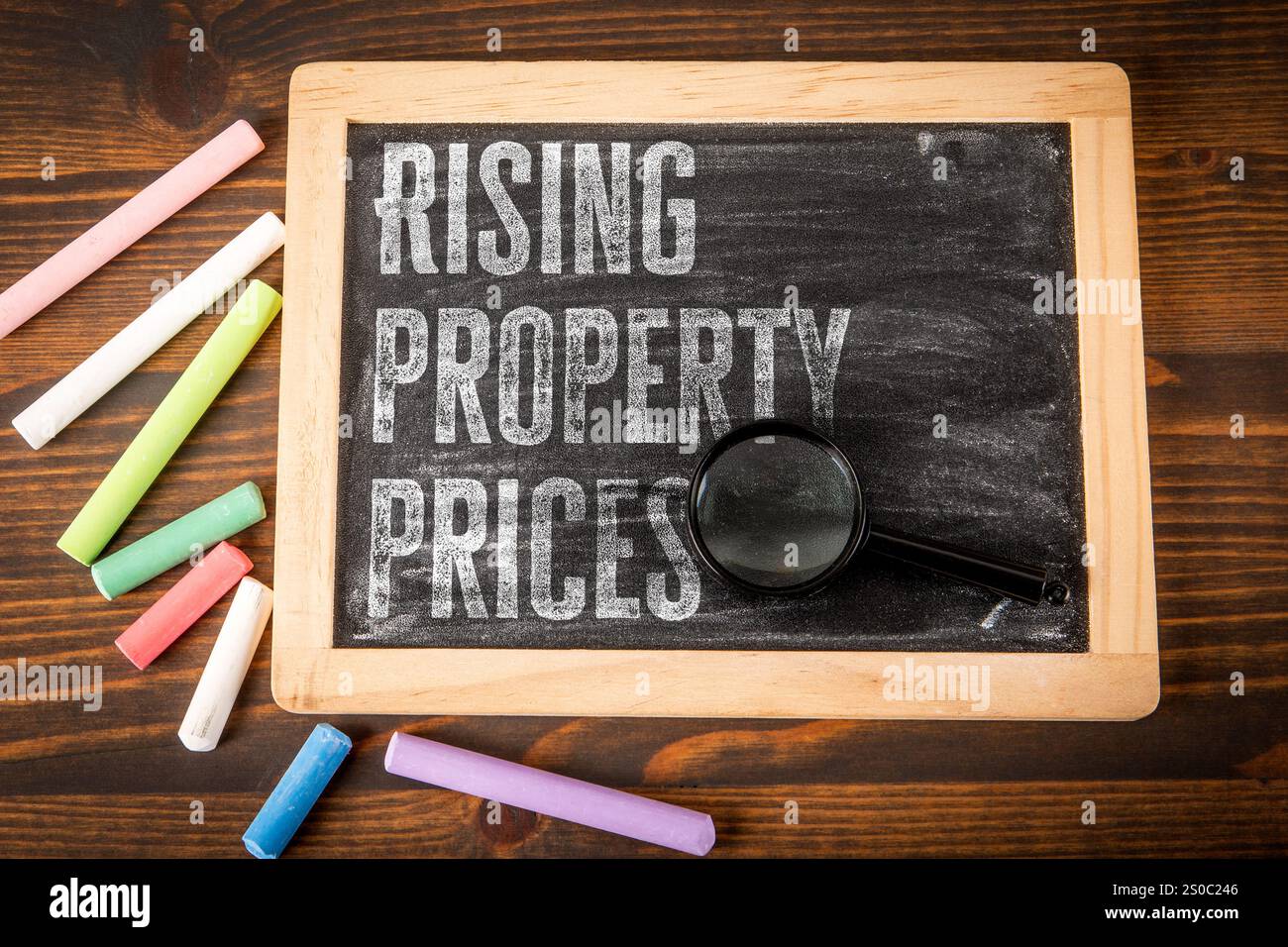 Rising property prices. Text on a chalkboard background Stock Photo - Alamy