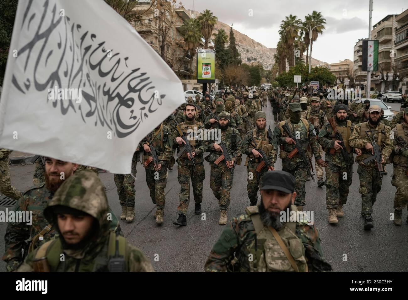 Members of the new armed forces, former rebels who overthrew Bashar ...