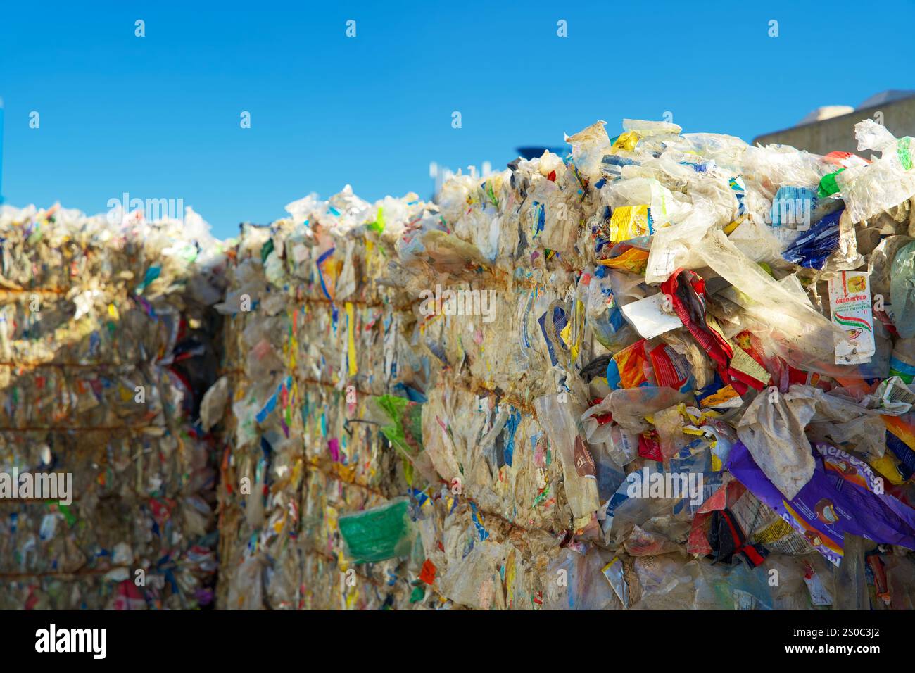 Stack of plastic residual mix waste in a plastic recycling factory ...