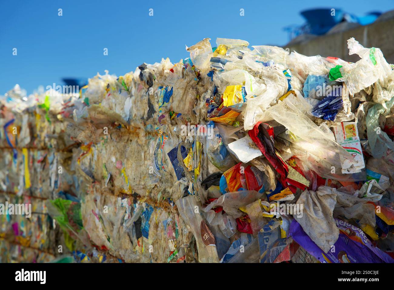 Stack of plastic residual mix waste in a plastic recycling factory ...