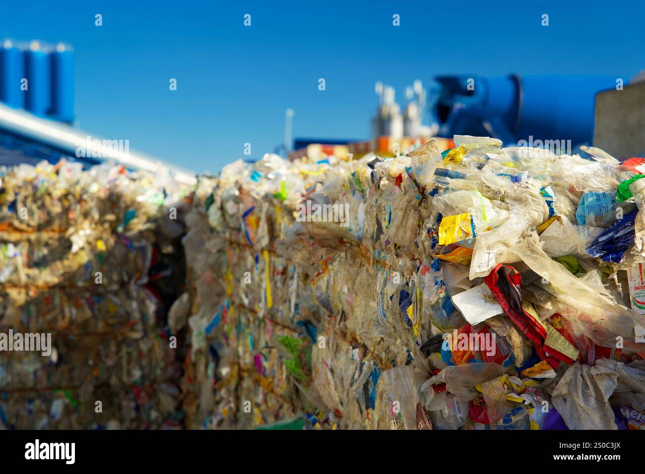 Stack of plastic residual mix waste in a plastic recycling factory ...