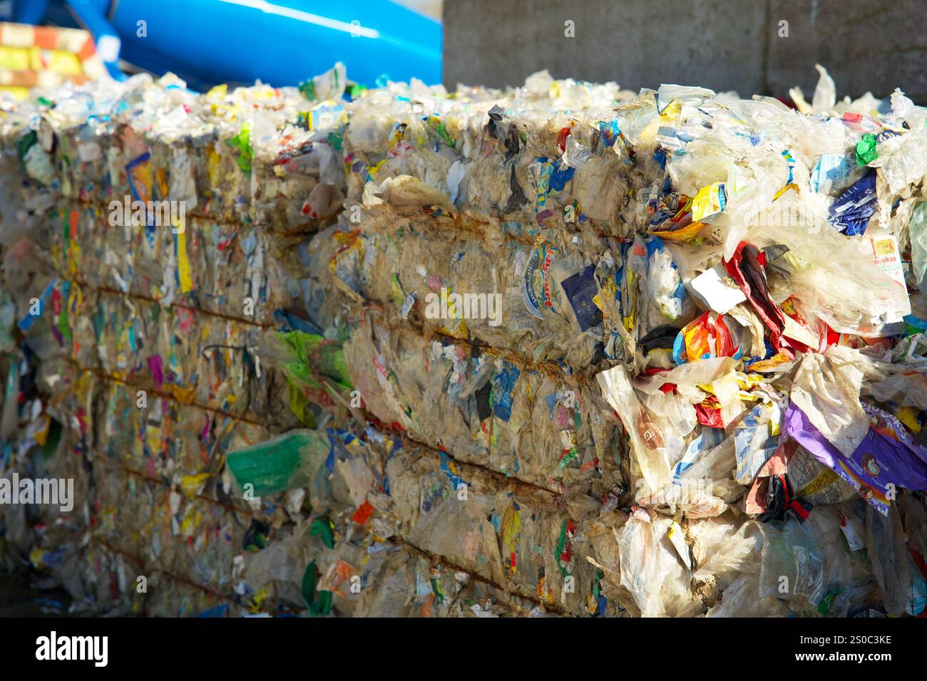Stack of plastic residual mix waste in a plastic recycling factory ...