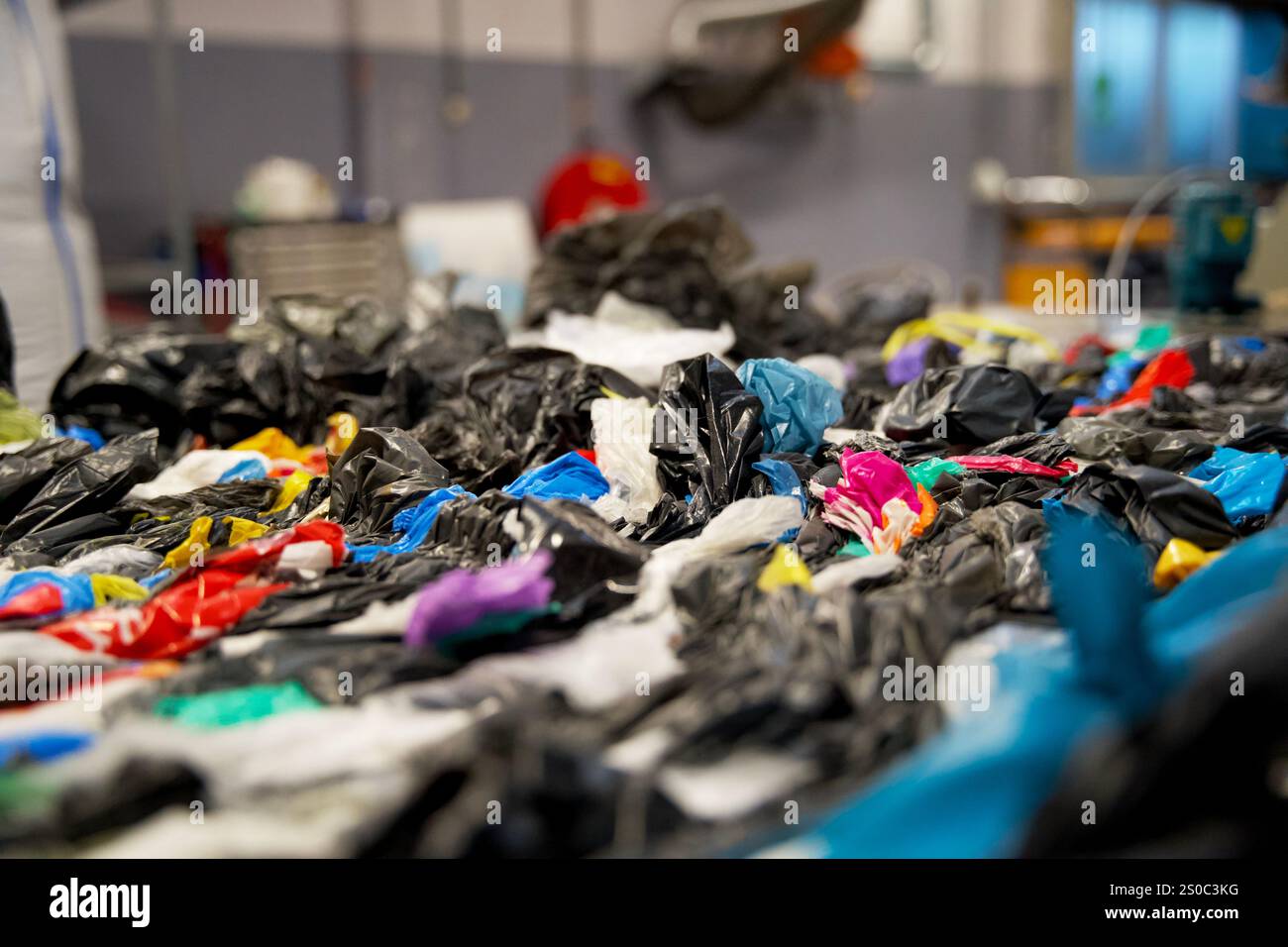 Stack of plastic residual mix waste in a plastic recycling factory ...