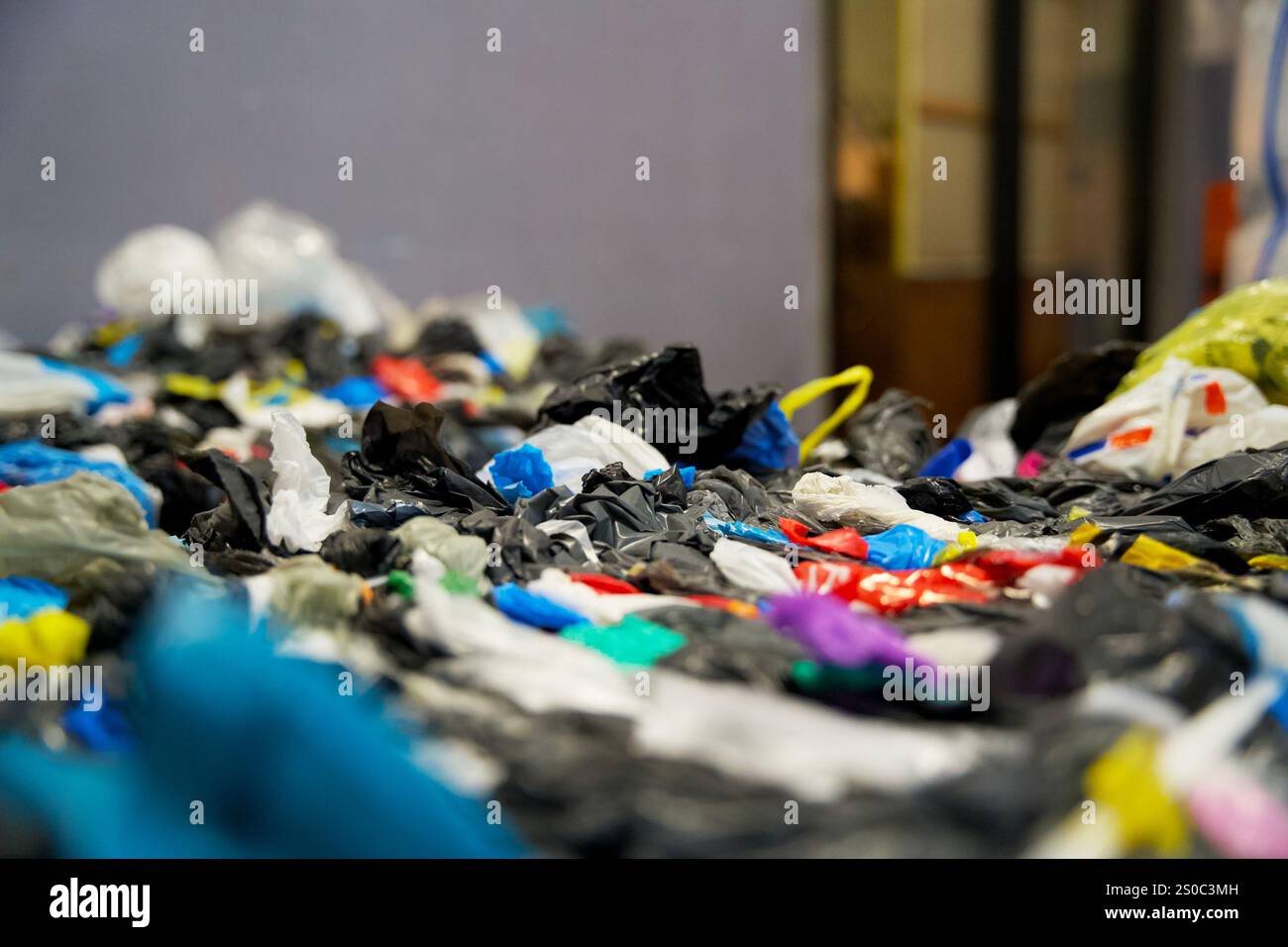 Stack of plastic residual mix waste in a plastic recycling factory ...