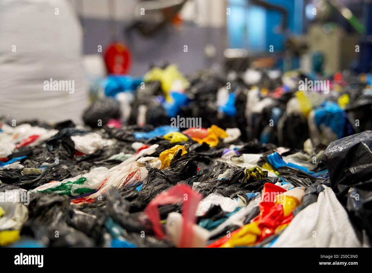 Stack of plastic residual mix waste in a plastic recycling factory ...