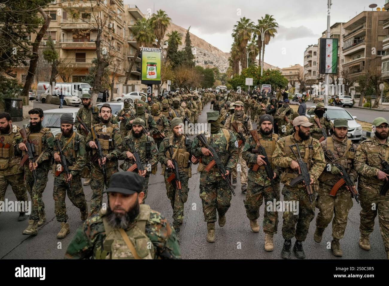 Members of the new armed forces, former rebels who overthrew Bashar ...