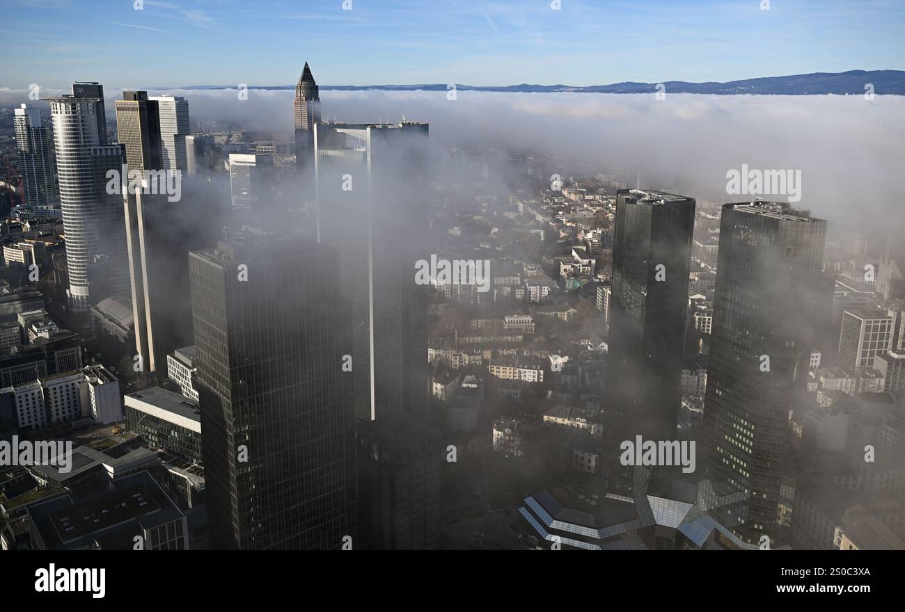 27 December 2024, Hesse, Frankfurt/Main: A low-lying cloud layer, also ...