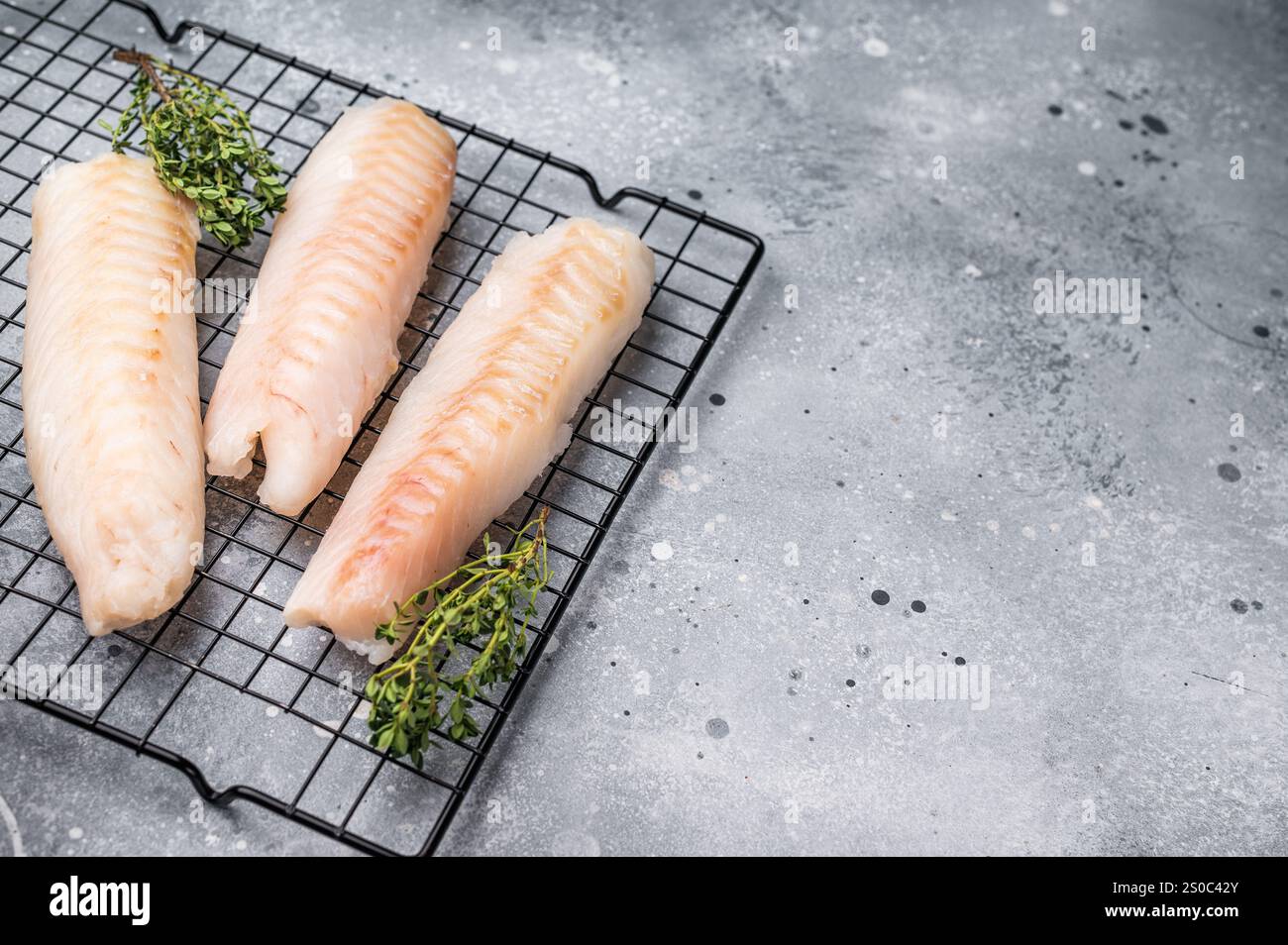 Fresh raw cod fish fillet, Boneless white fish meat. gray background ...
