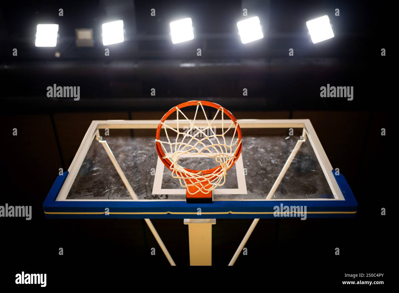 Basketball hoop in a sports hall Stock Photo - Alamy